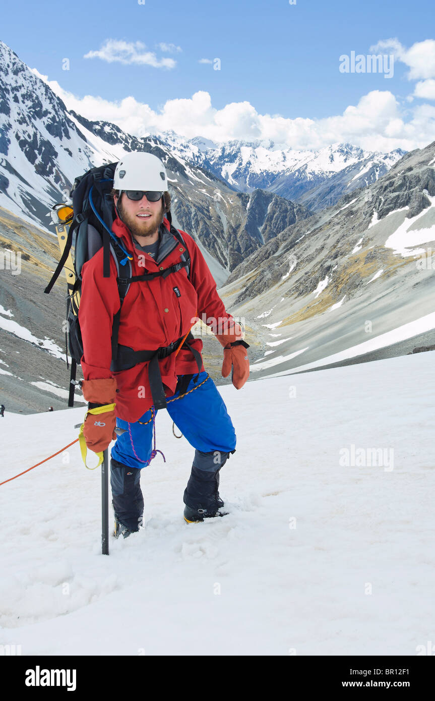 New Zealand, South Island, Arrowsmith Range. Kyle Bishop in front of a ...