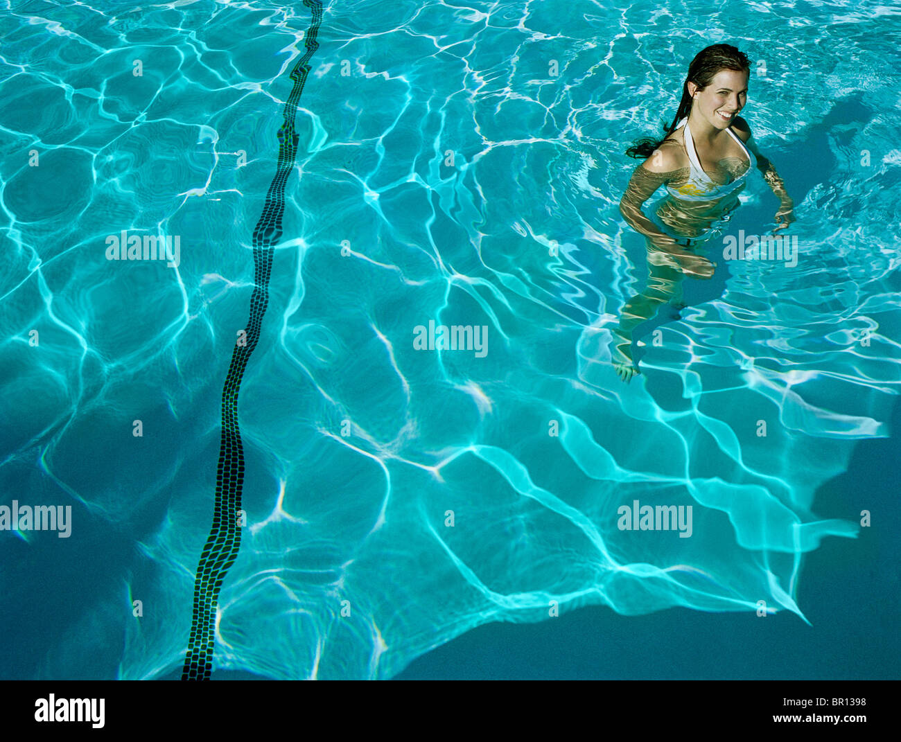 Woman on swimming pool hi-res stock photography and images - Alamy