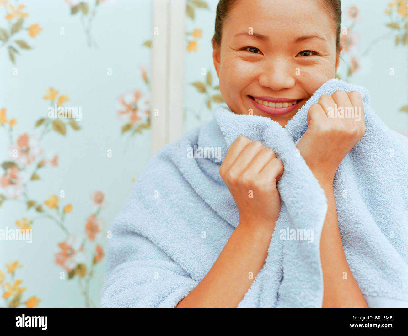 Woman wrapped in towel Stock Photo - Alamy