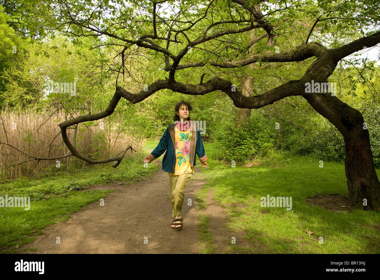 Young woman walks in the springtime in Prospect Park, Brooklyn, New ...