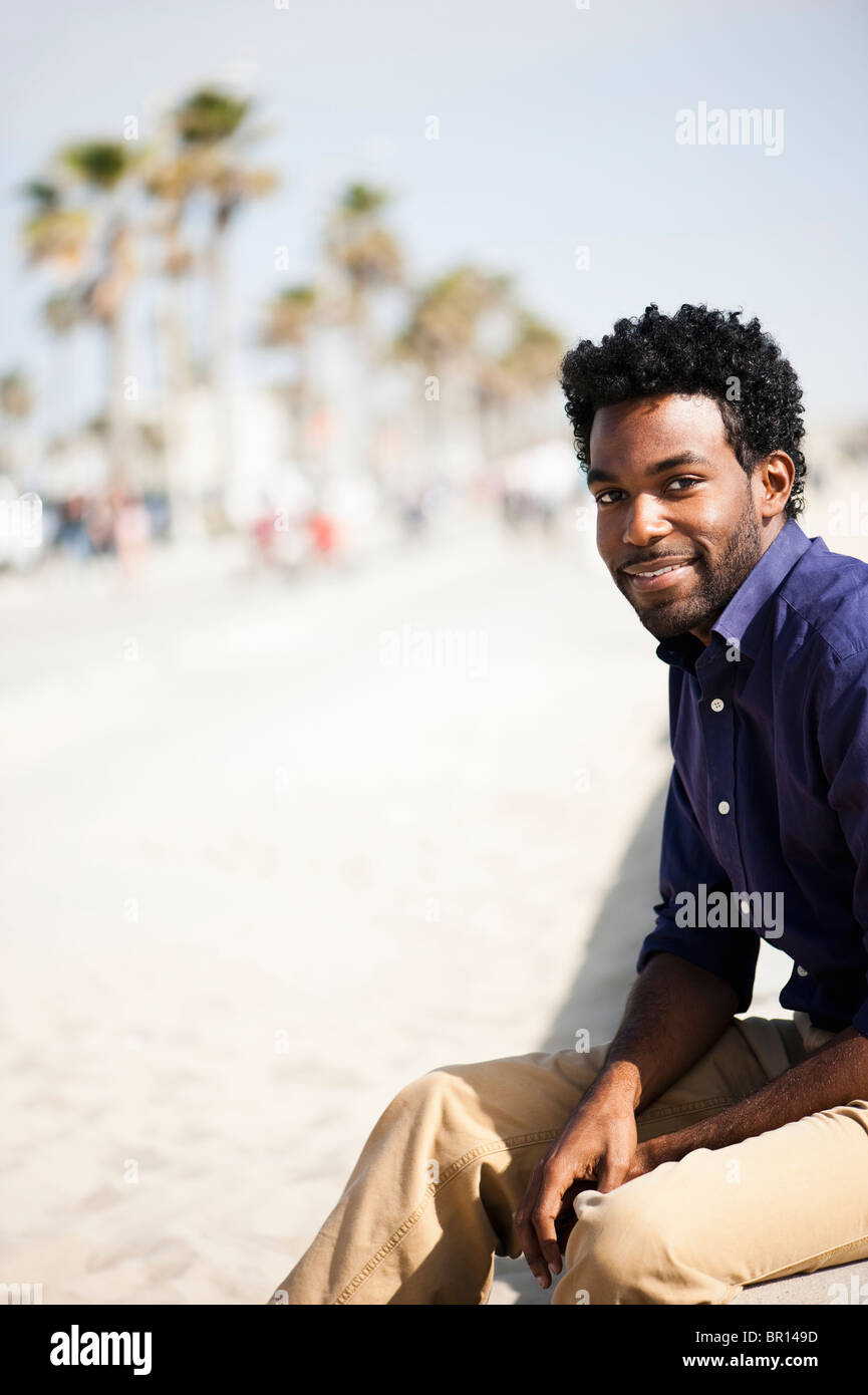 African American man sitting outdoors Stock Photo - Alamy