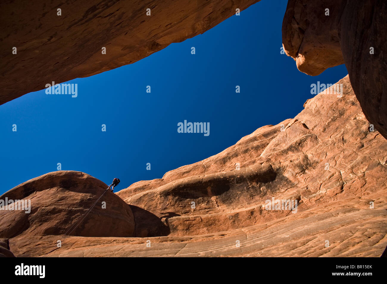 A man rappelling, Arches National Park, Moab, Utah Stock Photo - Alamy
