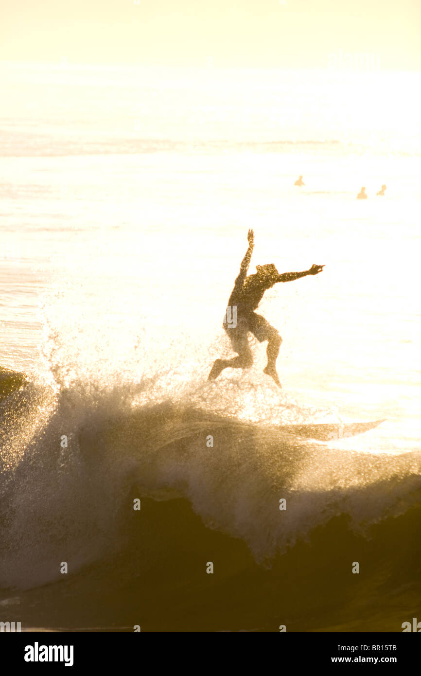 Man surfing and jumping over wave, Brazil Stock Photo - Alamy