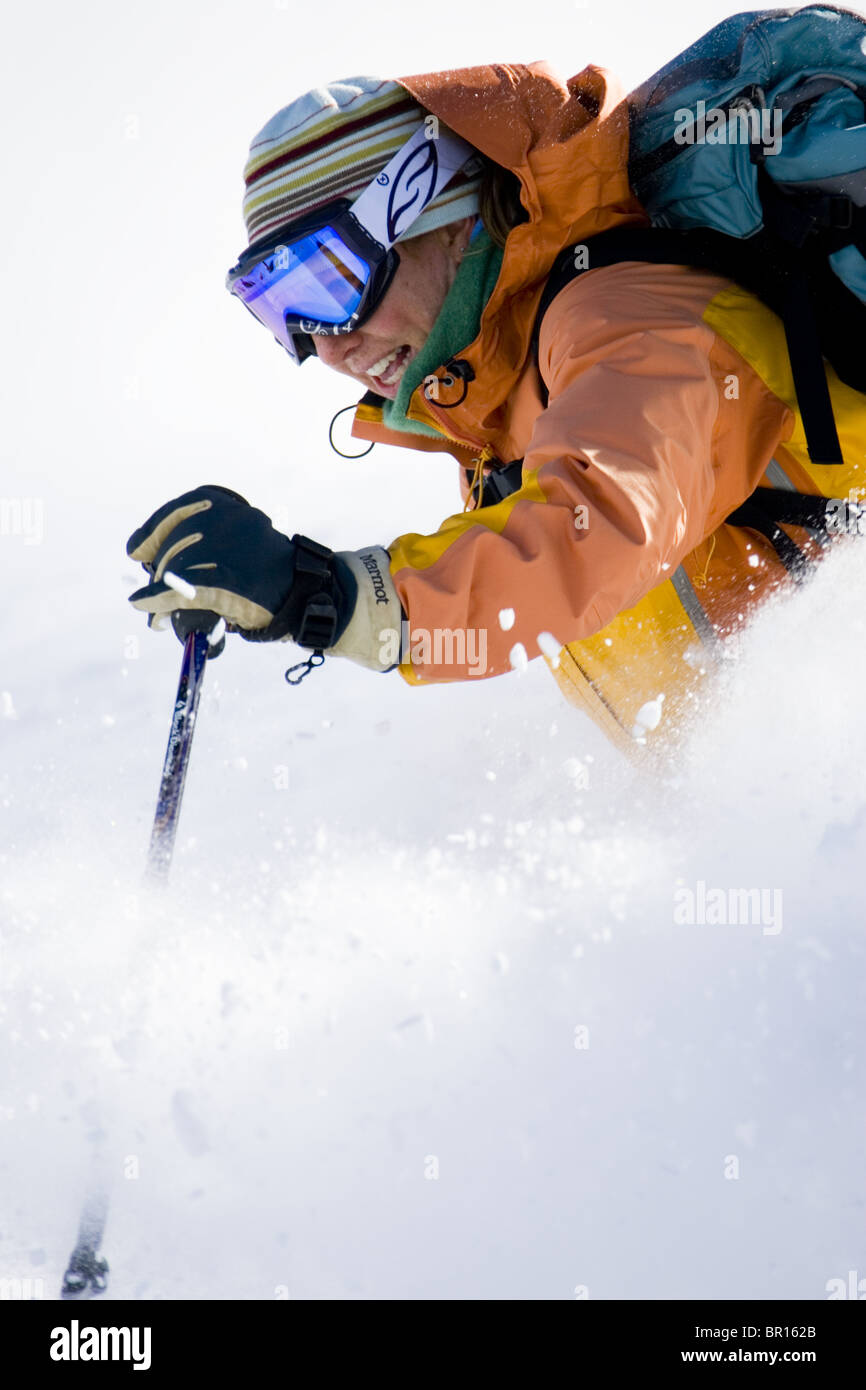 Woman powder skiing, France Stock Photo - Alamy