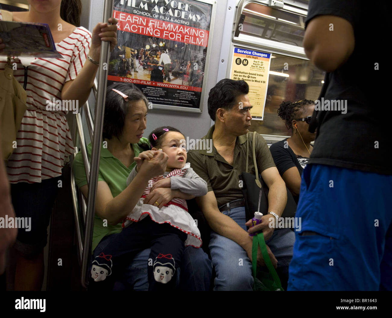 Chinese family rides the New York City subway on the lower east side of ...