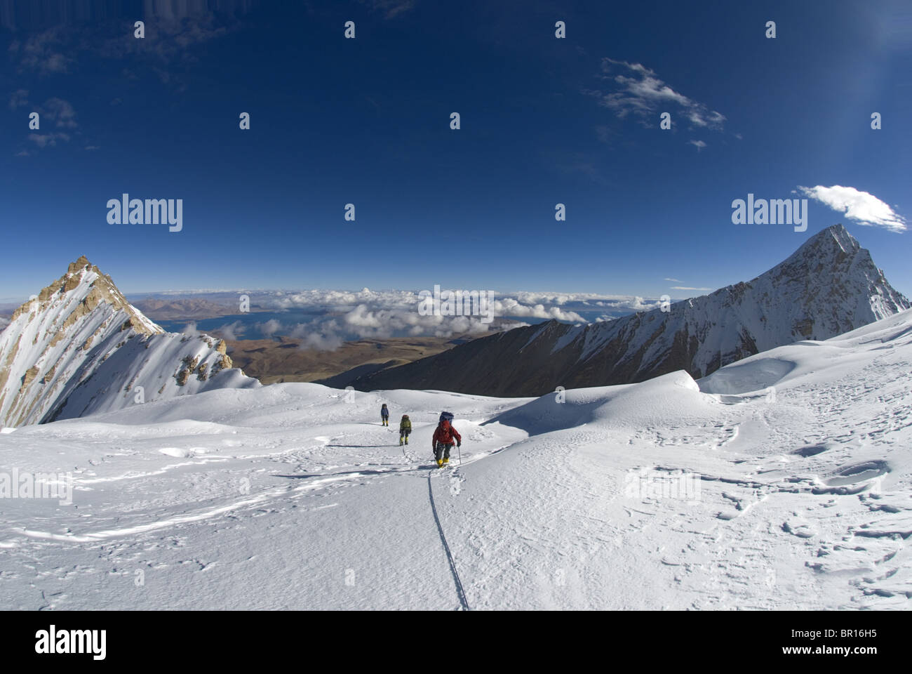 Three climbers on Gurla Mandhata Stock Photo - Alamy