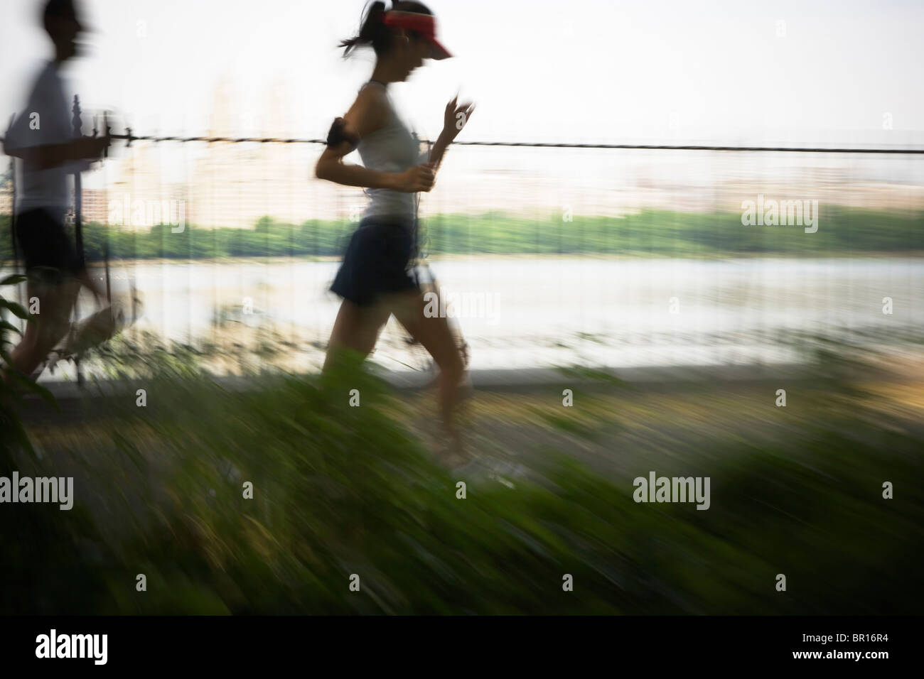 Two people running Stock Photo - Alamy