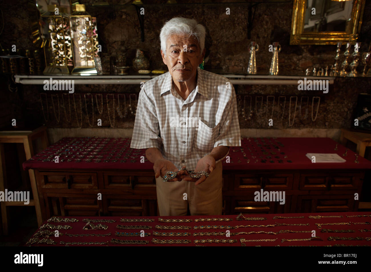 A silversmith holds a necklace, designed by the late William Spratling ...