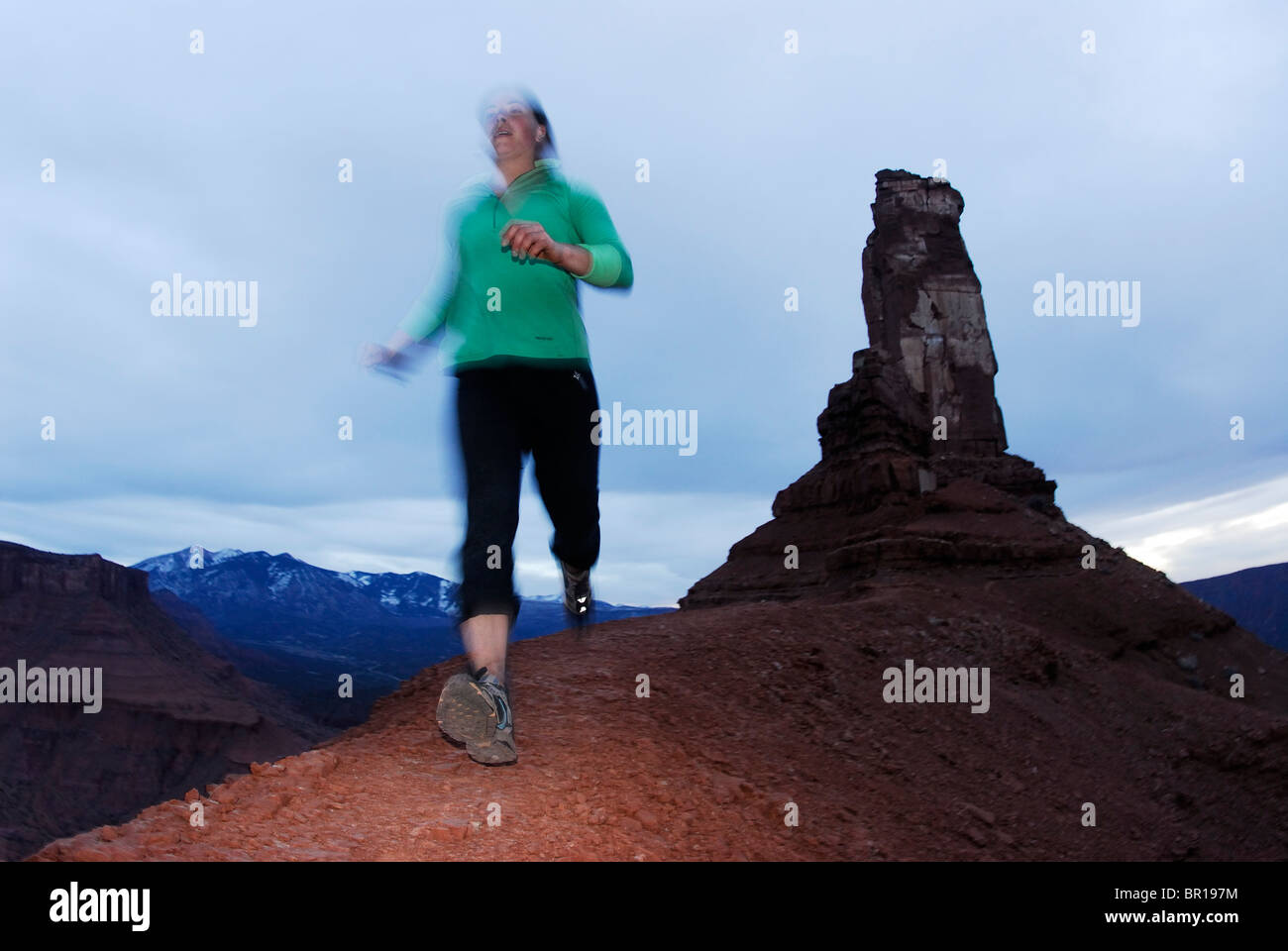 Woman trail running in Castle Valley, Utah. (motion blur Stock Photo ...