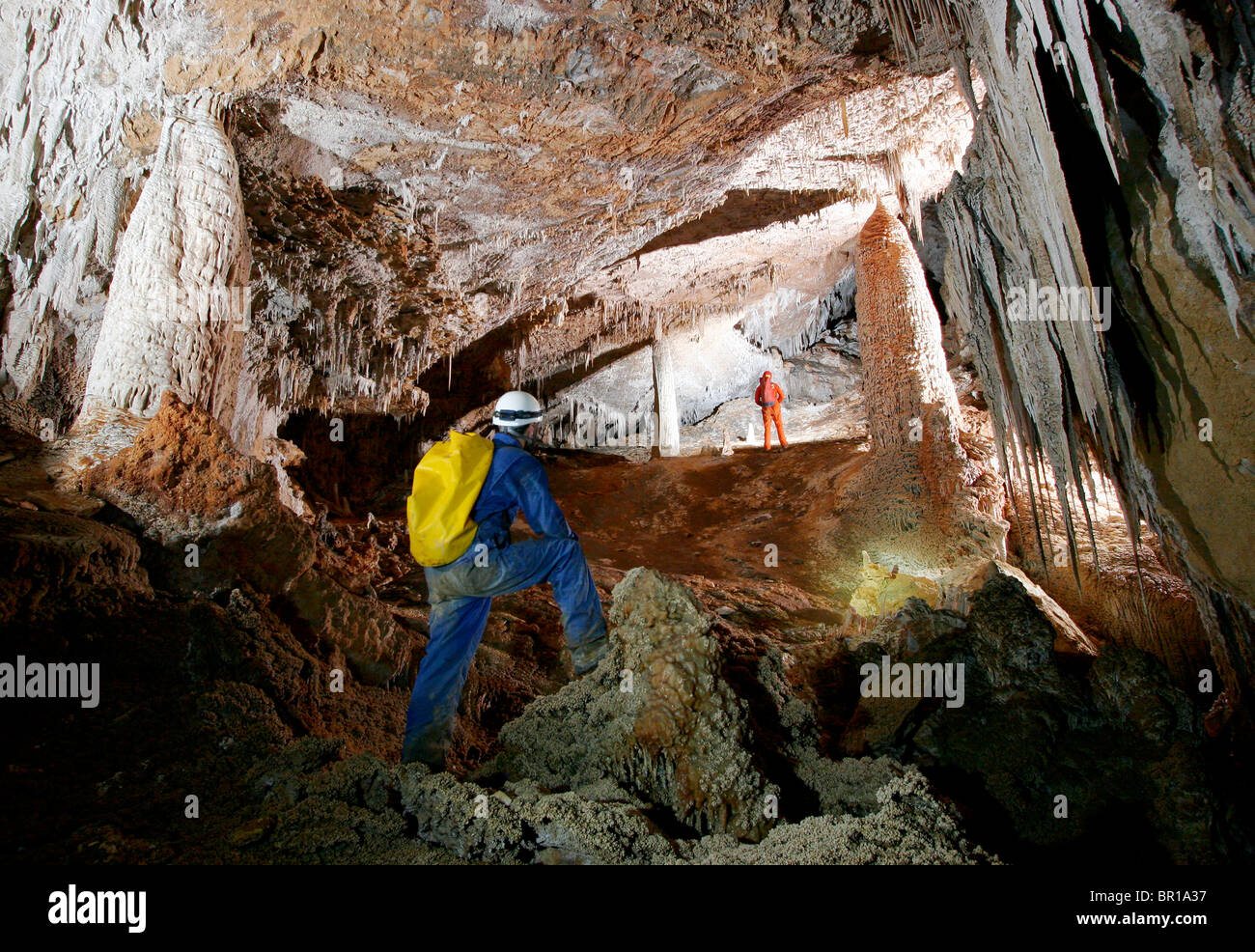 Cave explorers add scale to a cave in Mulu National Park Stock Photo ...