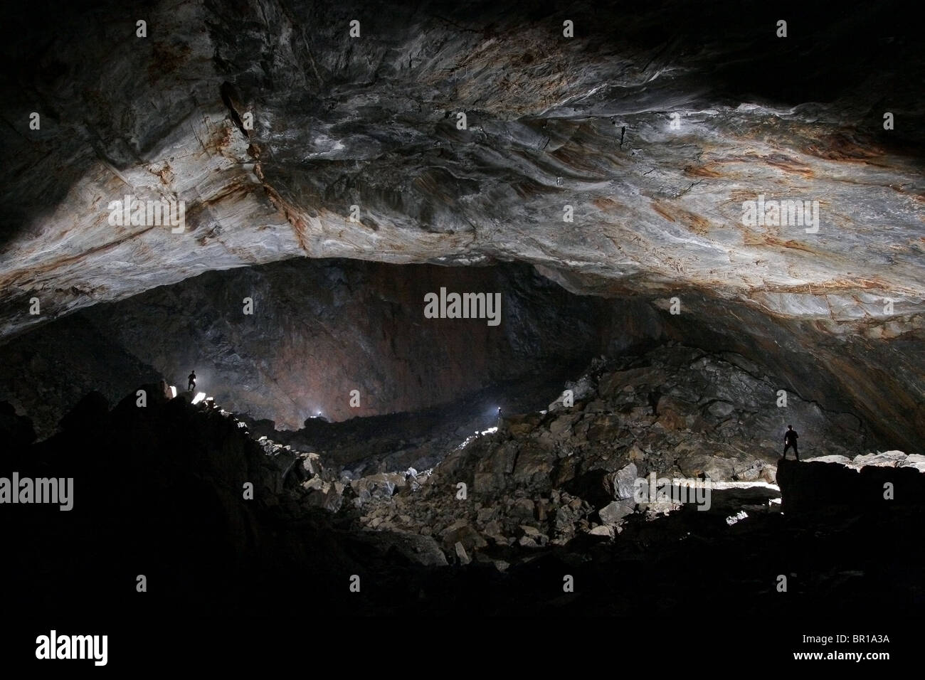 Cave explorers light up a vast underground room in Mulu National Park ...