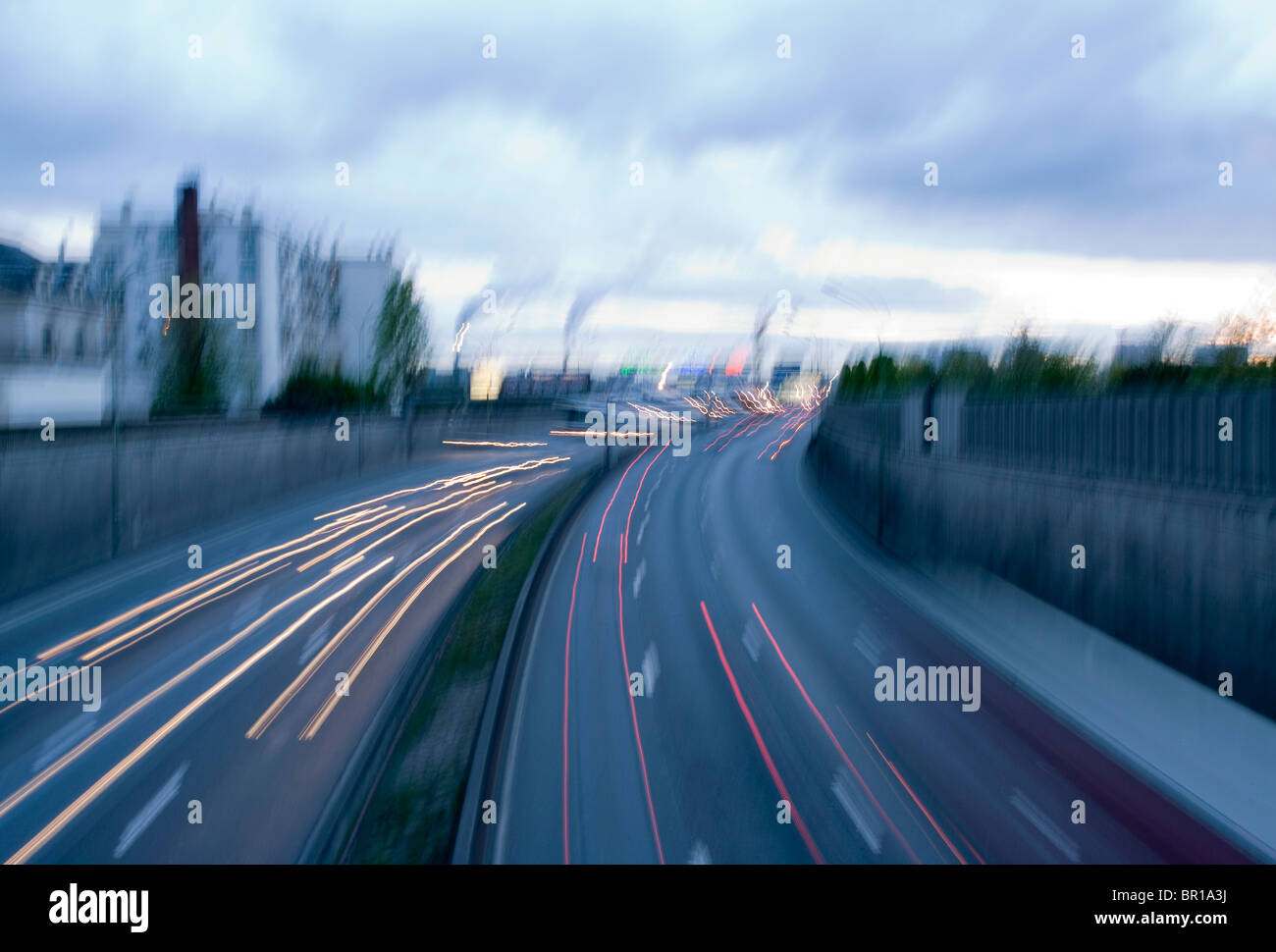 motorway (highway) with cars moving at speed in the suburbs of Paris ...