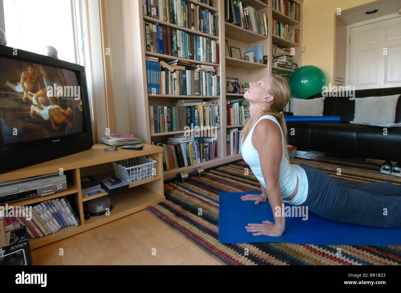 Tv yoga hi-res stock photography and images - Alamy
