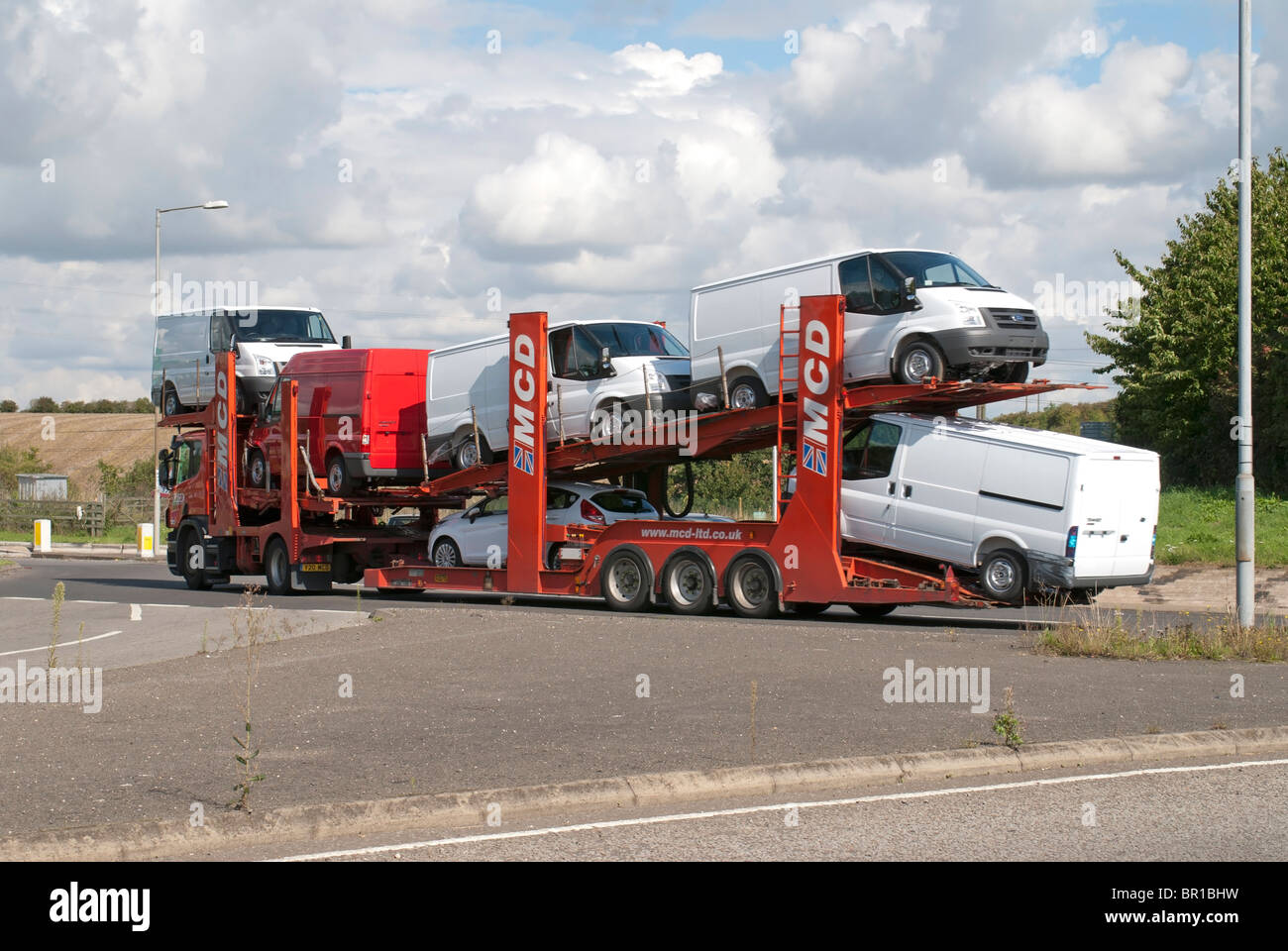 Lorry Transporting Vans Stock Photo - Alamy