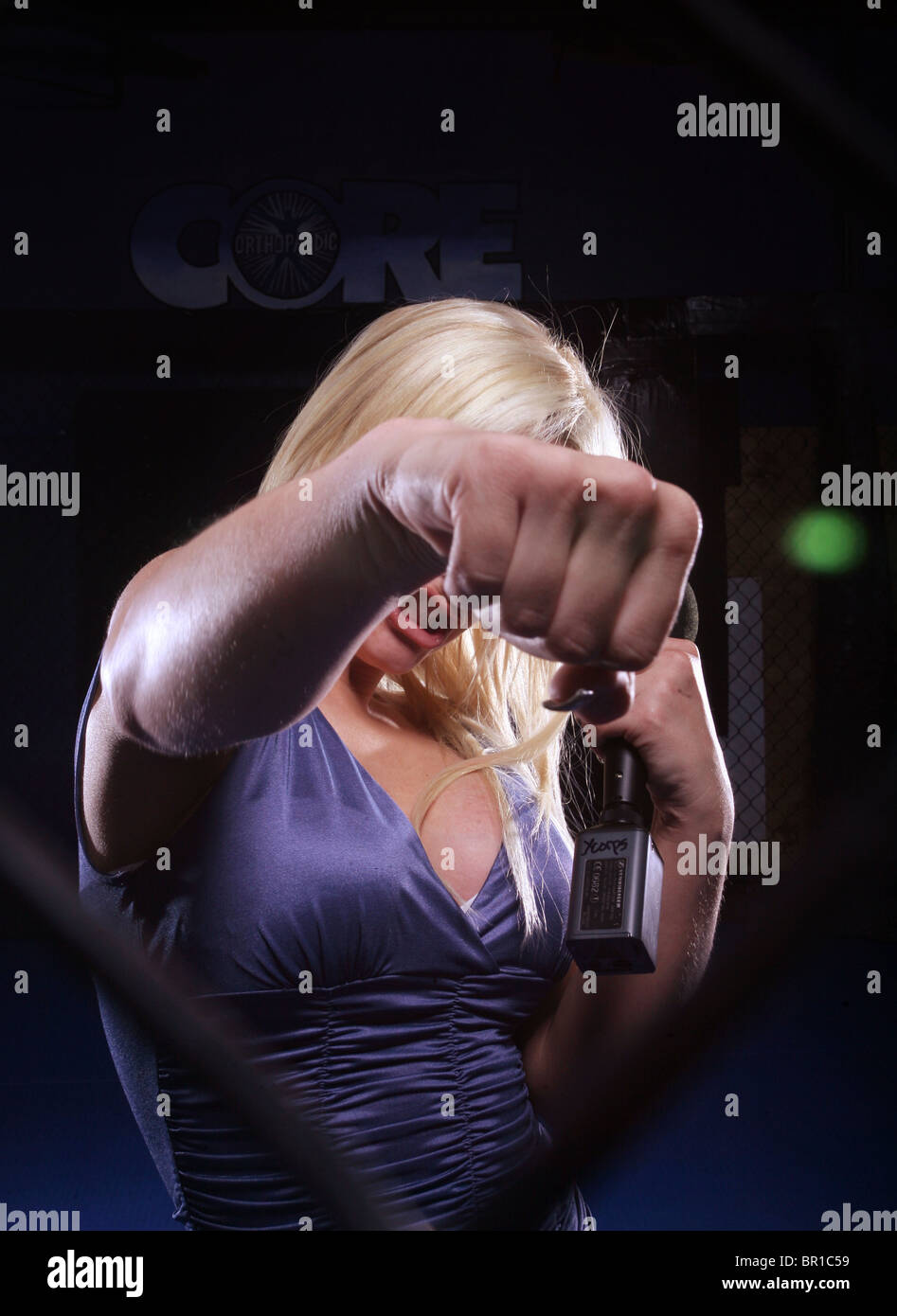 Blonde lady throws punch Stock Photo - Alamy