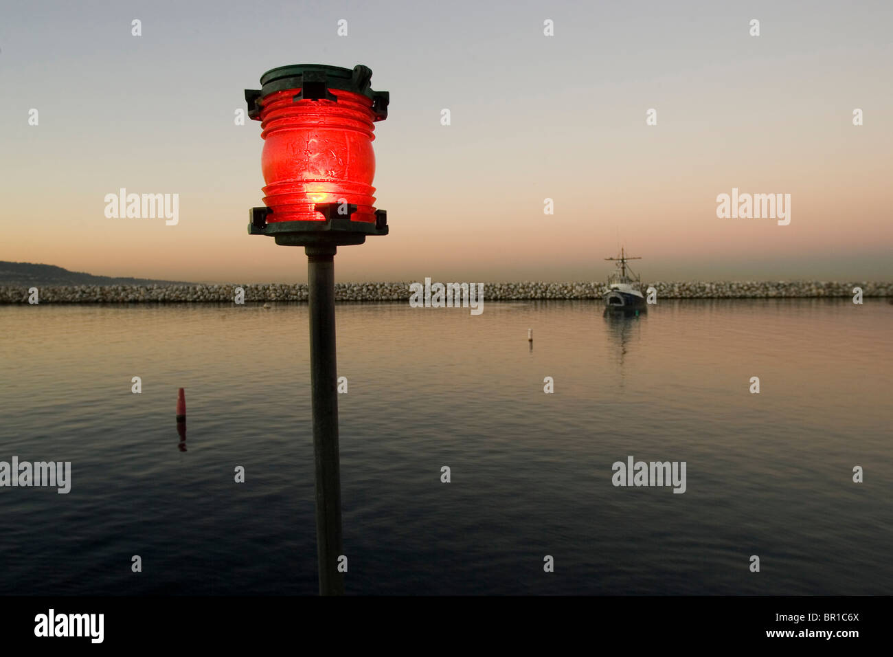 Red navigation light in a marina used to guide boat traffic, Redondo ...