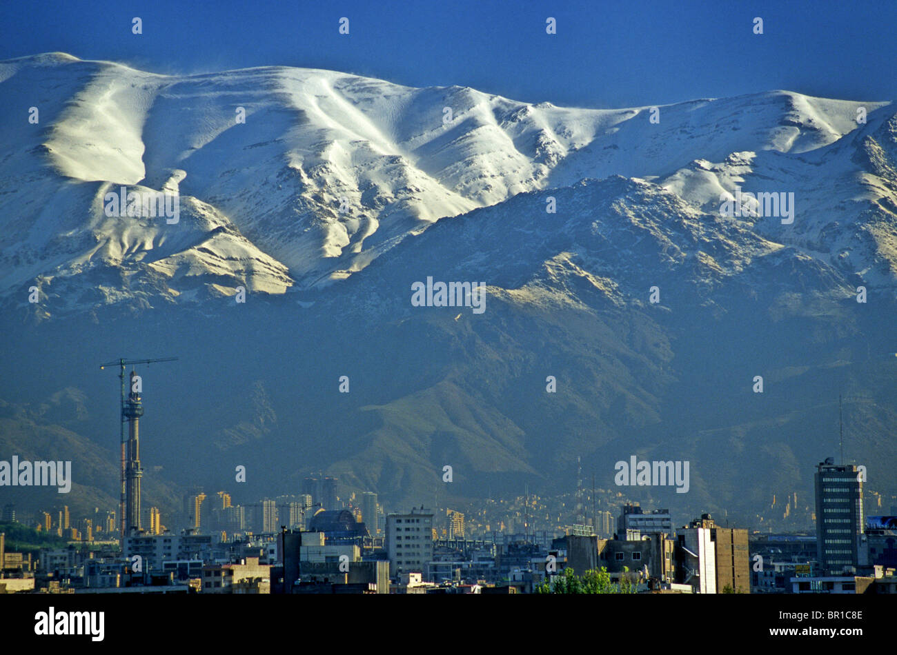 Downtown Tehran bustles against the mountains Stock Photo - Alamy