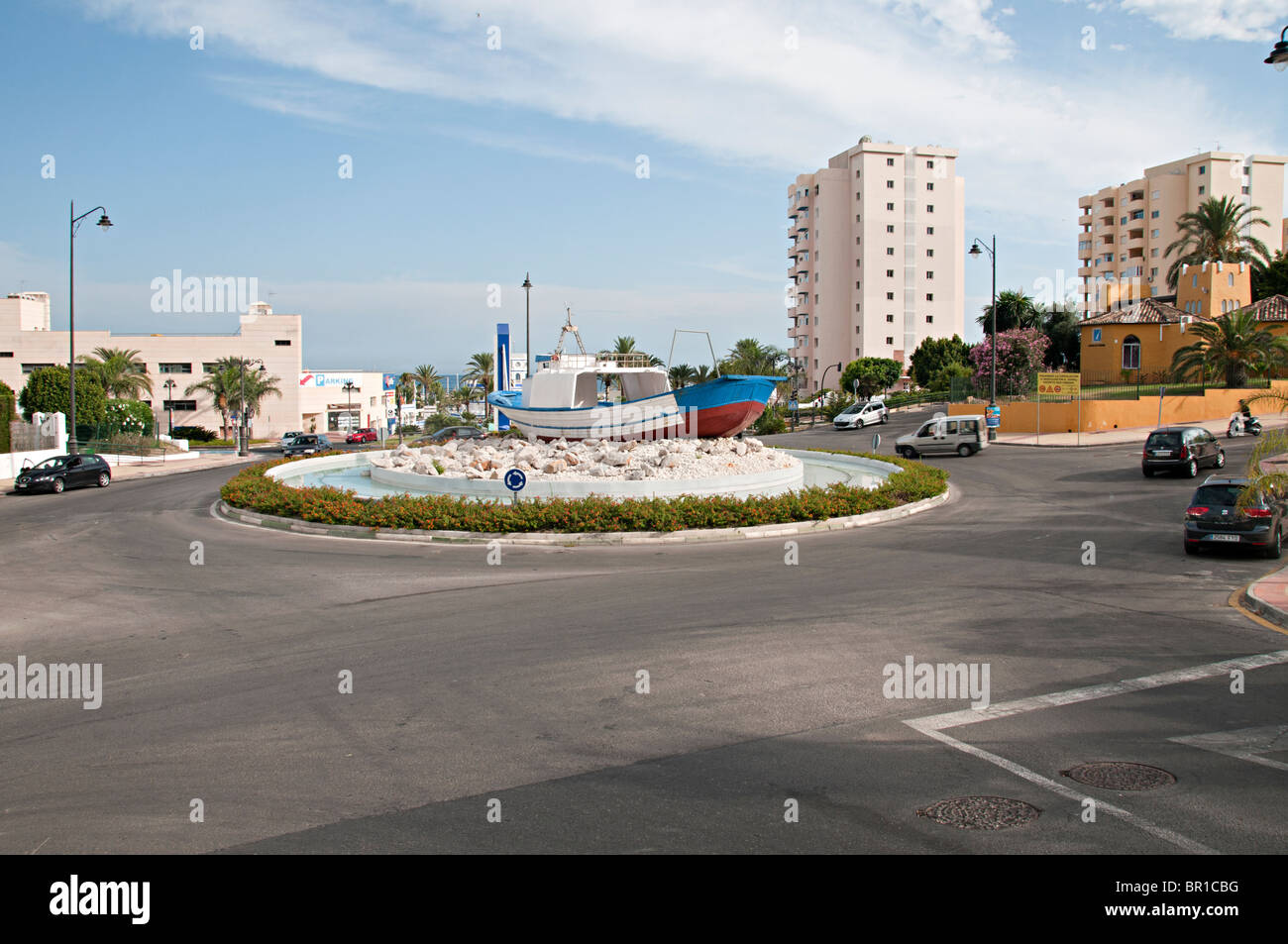 a boat on the roundabout outside the harbour in estepona spain Stock ...