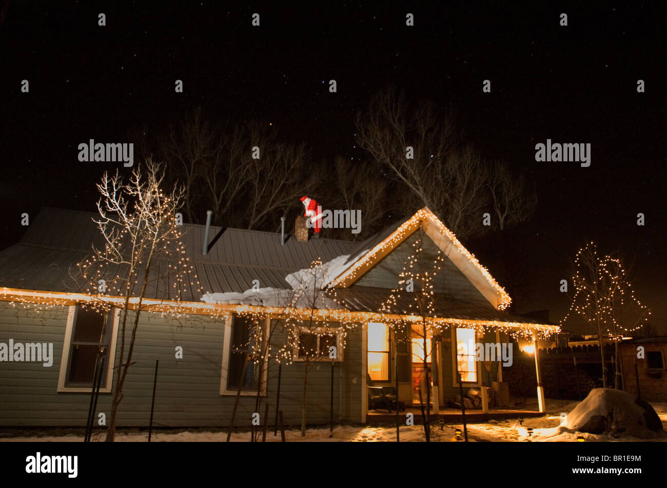 Santa Clause on house roof at night under the stars, Ridgway Colorado ...