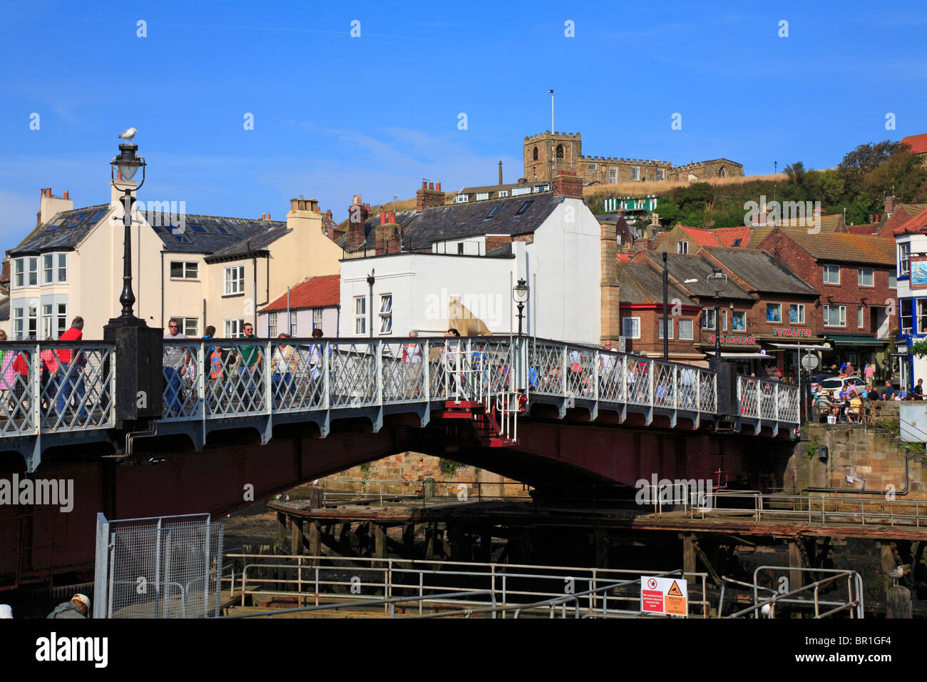 Tourists on the iron swing bridge, Whitby, North Yorkshire, England, UK ...