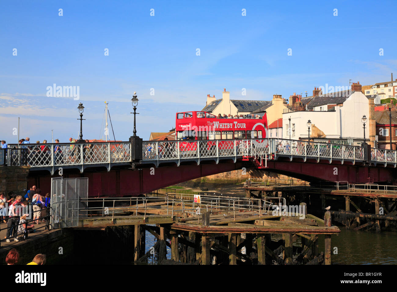 Open top tour bus crossing the Iron swing bridge, Whitby, North ...
