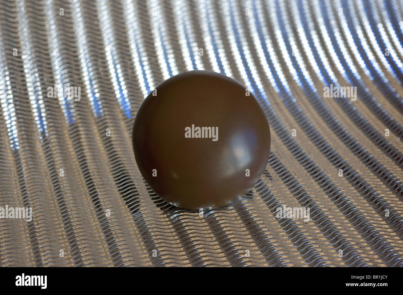 Hikaru dorodango hand made polished mud ball metallic background Stock ...