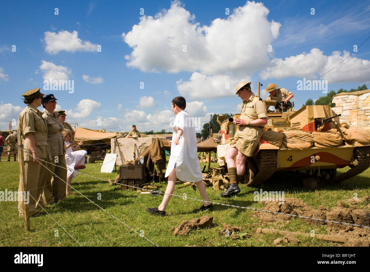 WWII reenactors in the sunshine by a tank at the War & Peace Show Stock ...