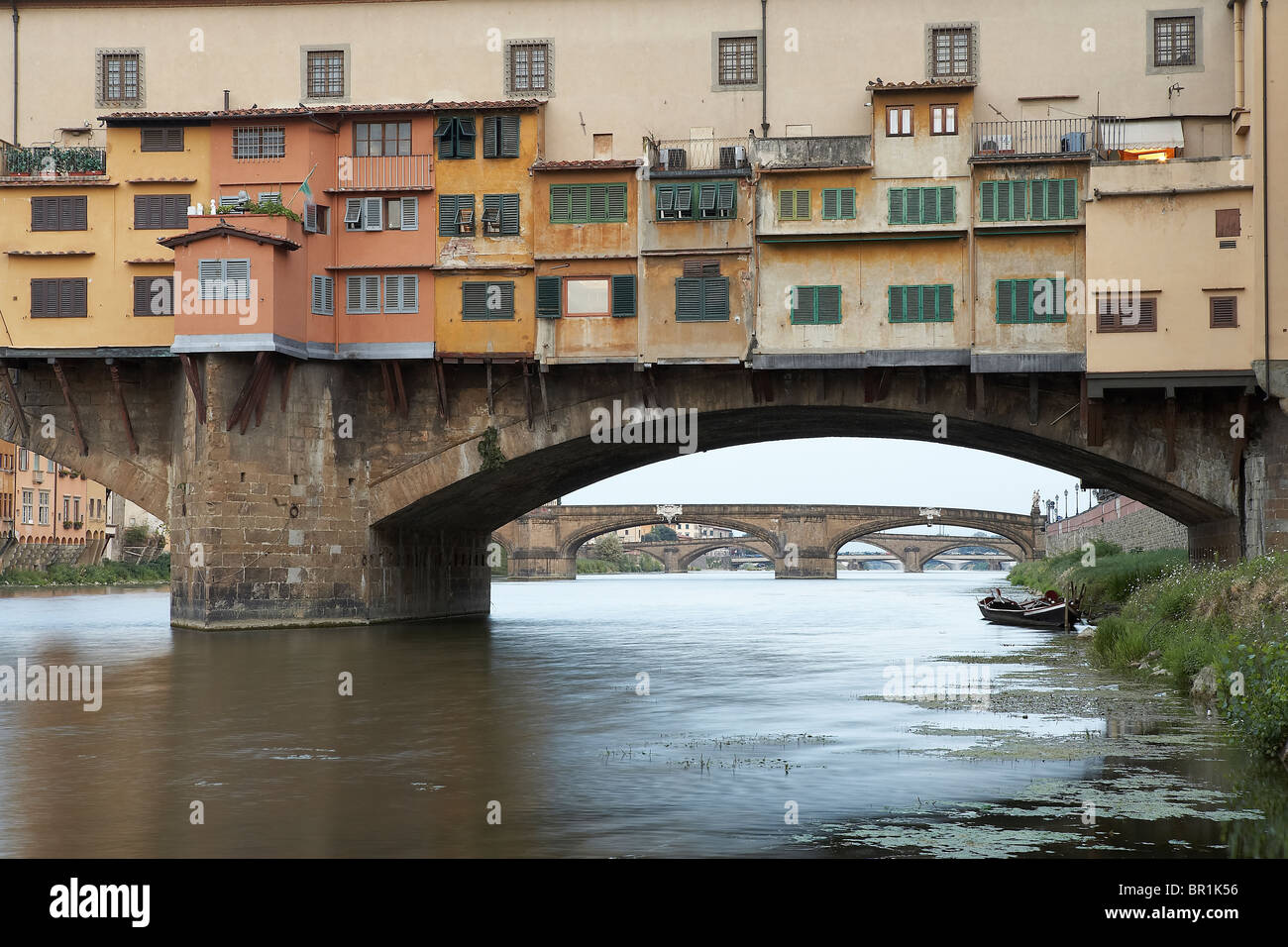 A bridge with stores crosses a European river Stock Photo - Alamy