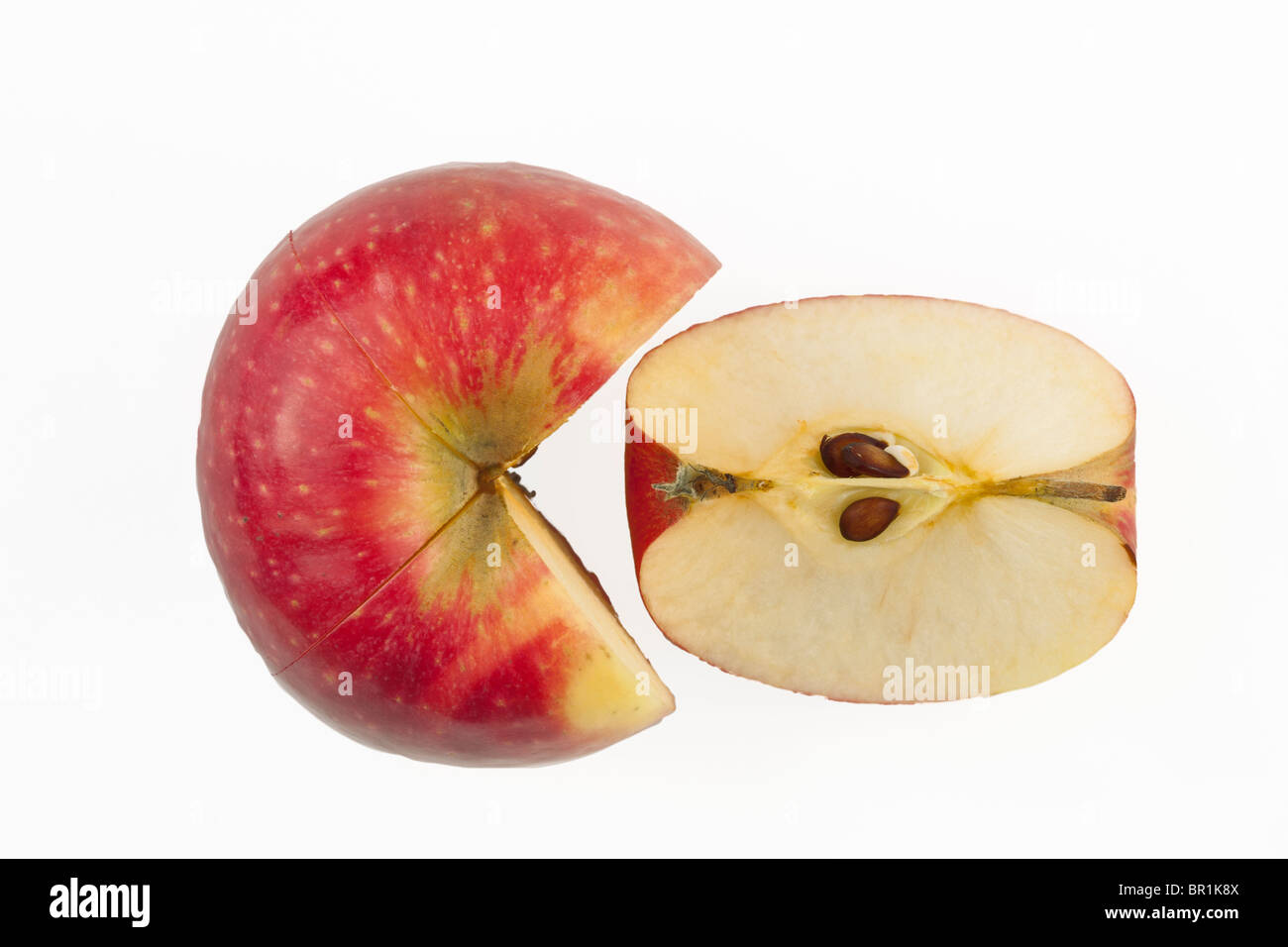 Apple half and round slice on a white background Stock Photo - Alamy