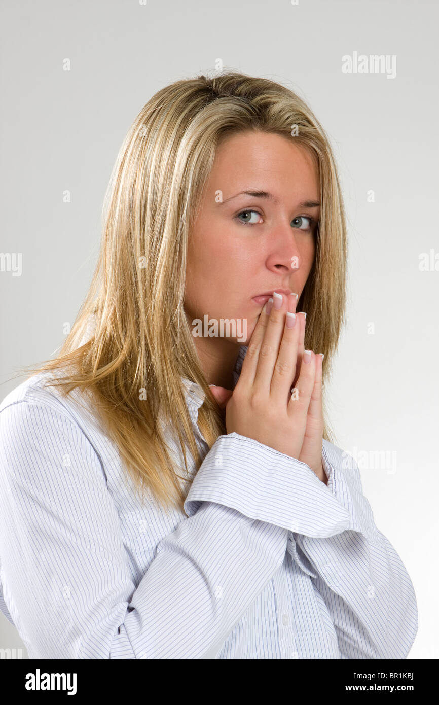 A young woman shows apprehension towards something Stock Photo - Alamy