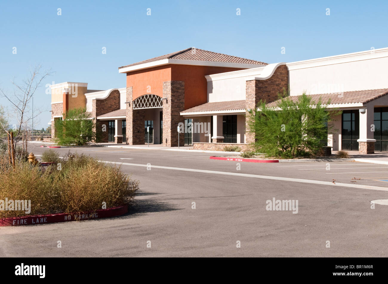 Retail spaces stand empty in an abandoned development project Stock ...