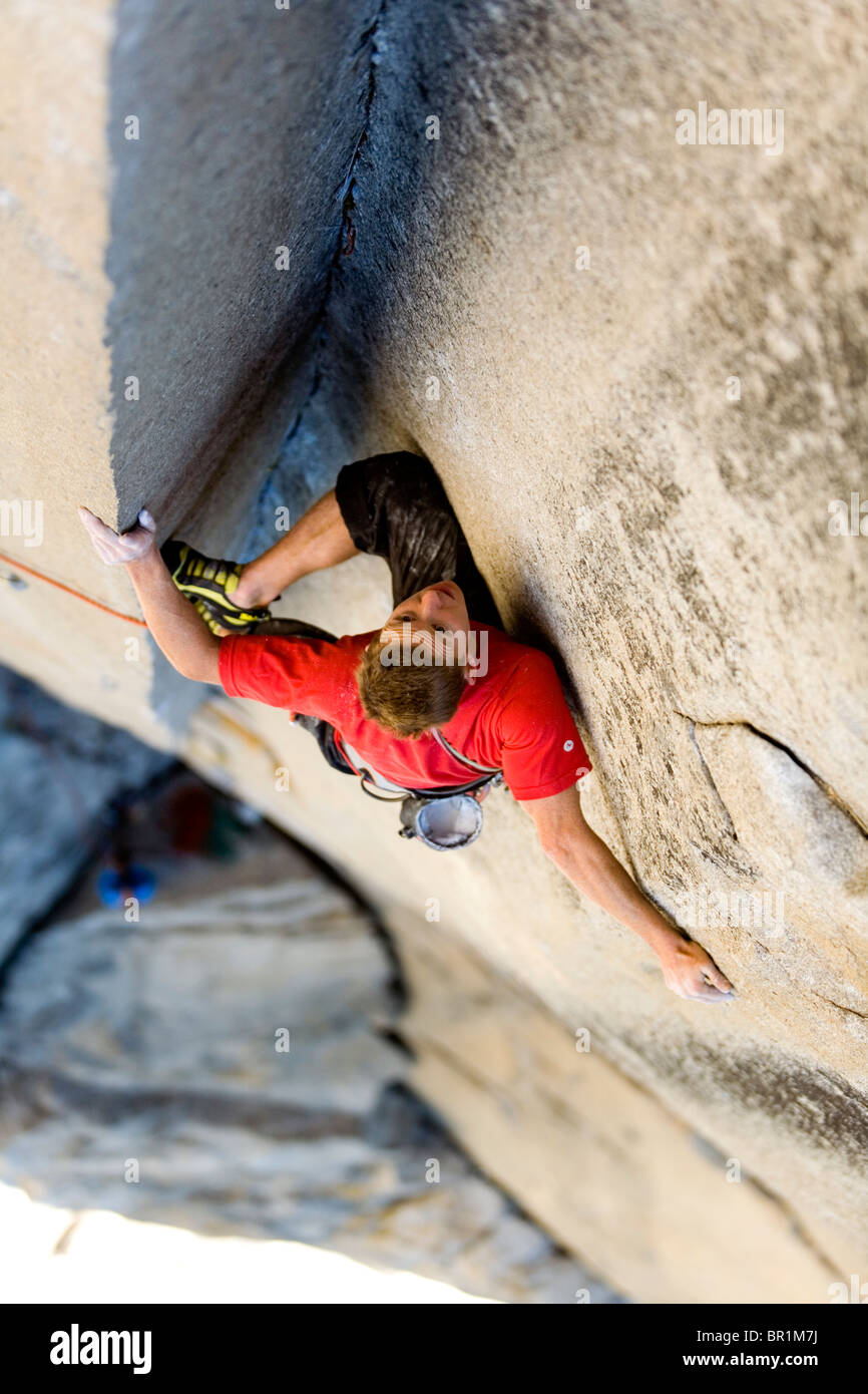 Male free climbing Stock Photo - Alamy