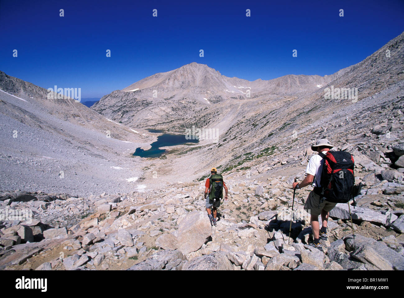 Tom Purcell leads the way into a boulder filled valley while ...