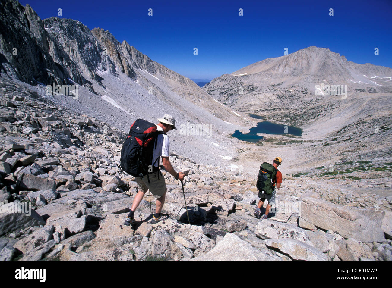 Tom Purcell leads the way into a boulder filled valley while ...