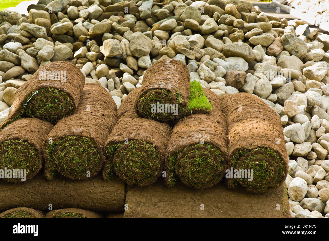Stack of turf rolls ready to be used in a landscaped garden Stock Photo ...