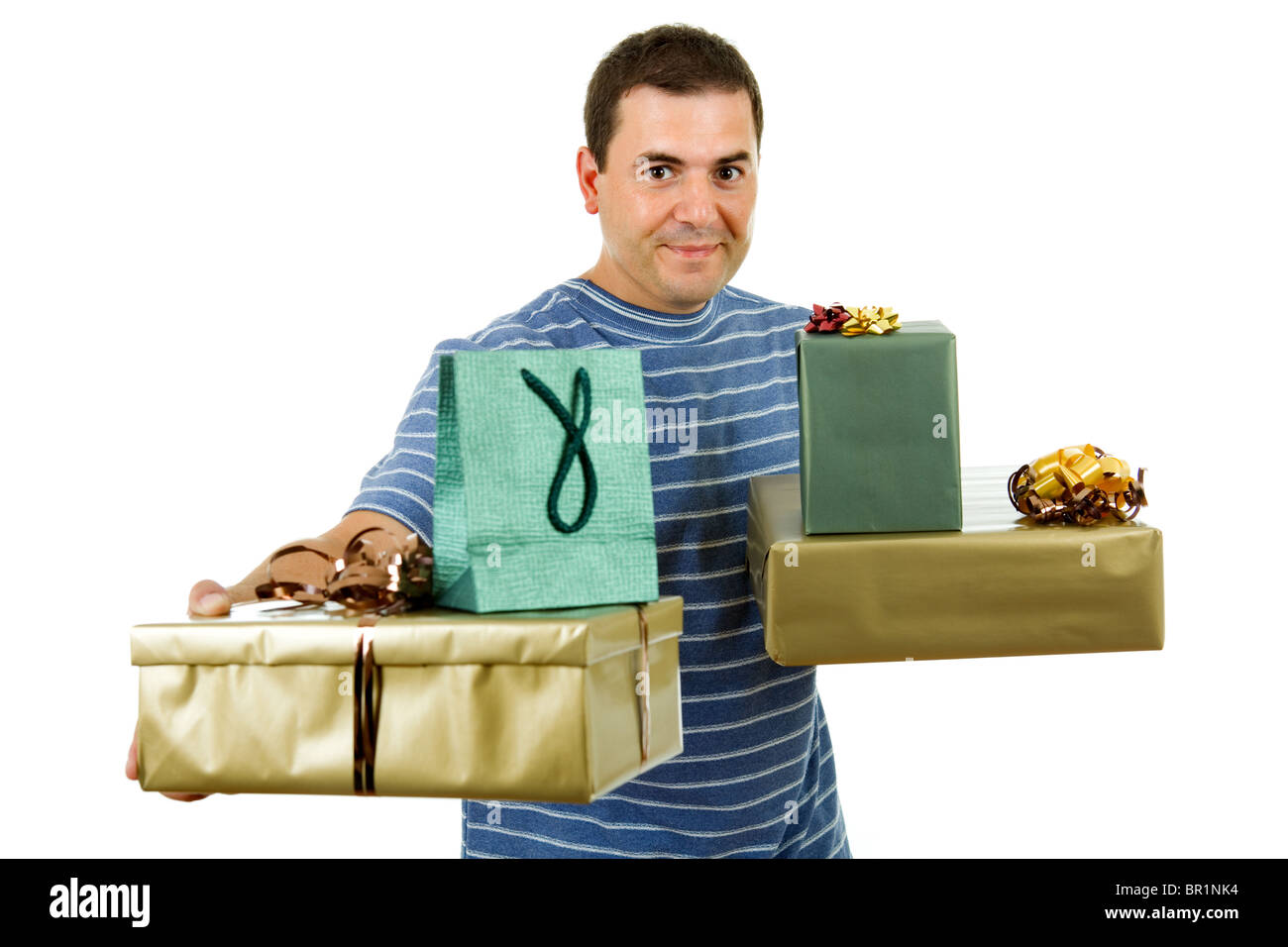 young casual man holding a few gifts, isolated Stock Photo - Alamy