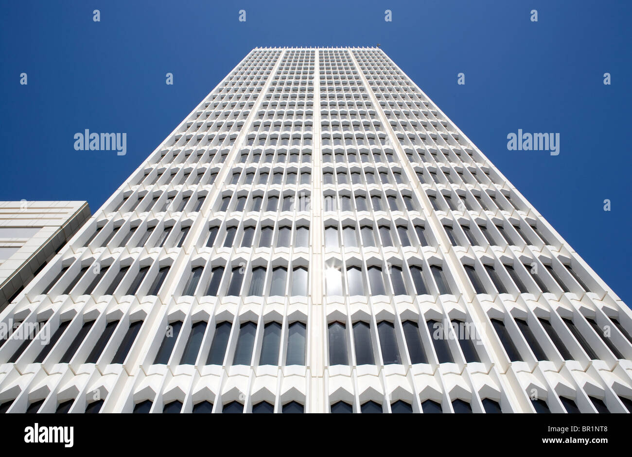 White modern building in Dubai with blue sky Stock Photo - Alamy