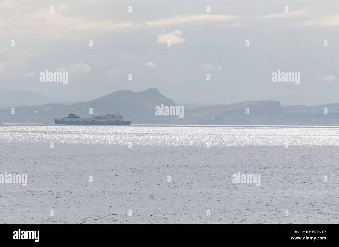 Norfolk line ferry in Firth of Forth with Holyrood Park Edinburgh ...