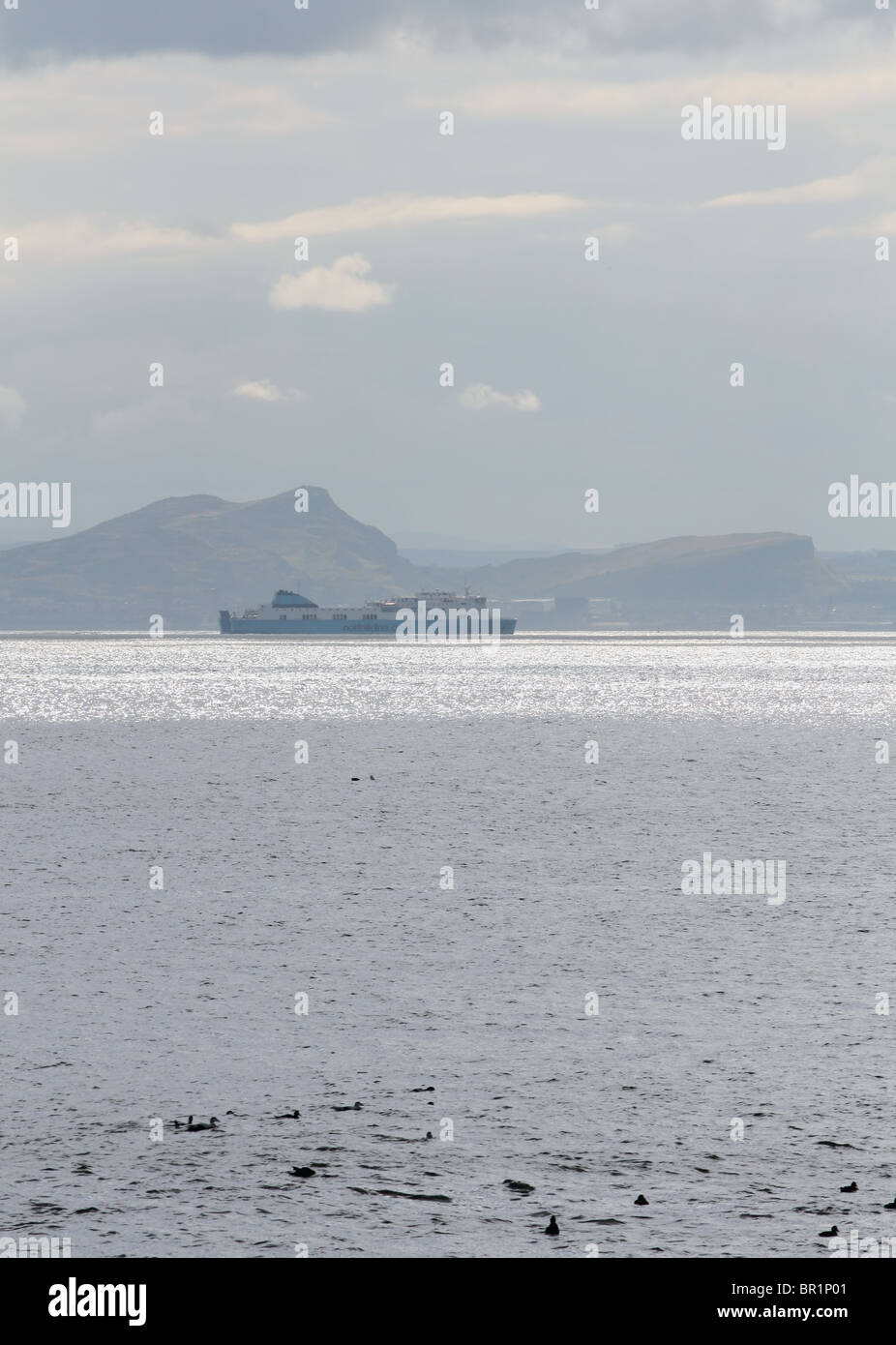 Norfolk line ferry in Firth of Forth with Holyrood Park Edinburgh ...