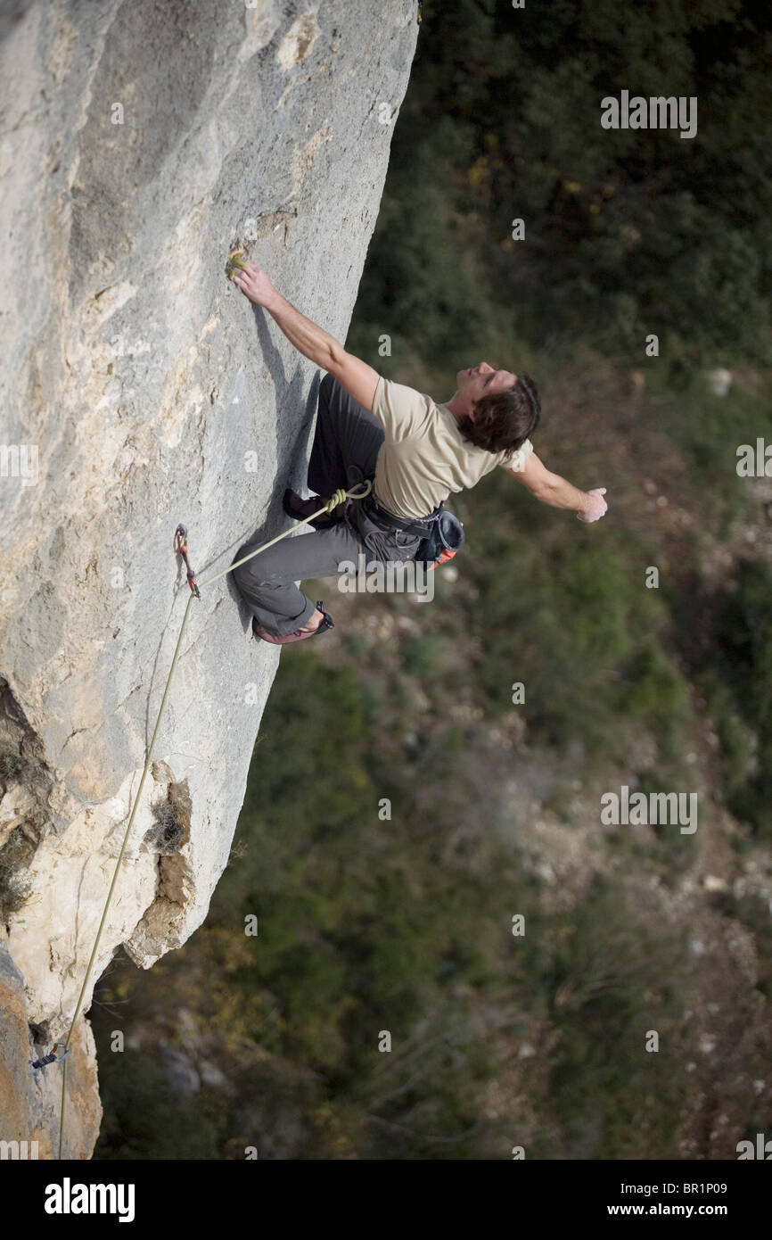 Man hanging by one arm hi-res stock photography and images - Alamy
