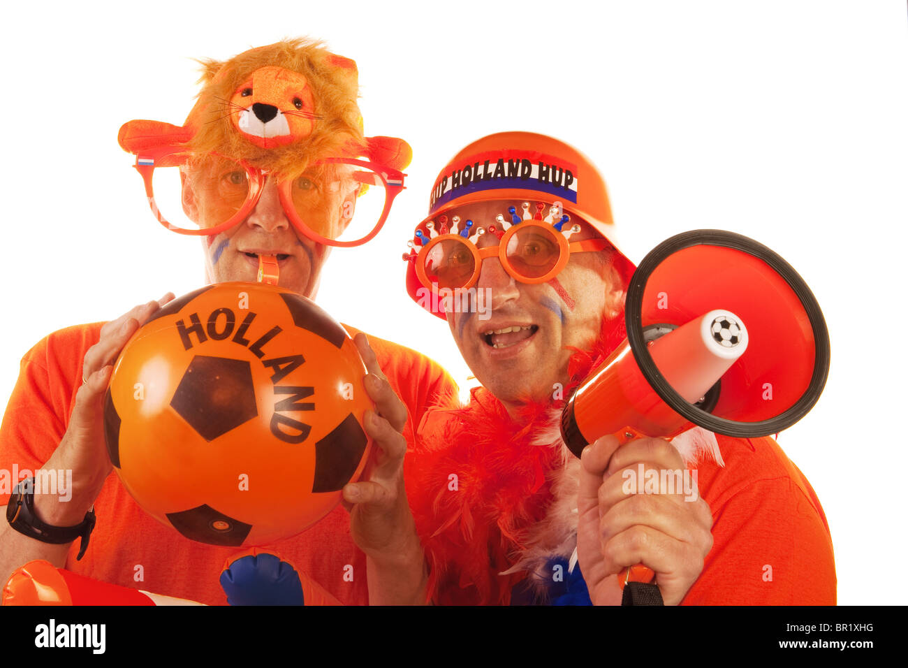 Dutch soccer fans dressed in orange with ball and megaphone Stock Photo ...
