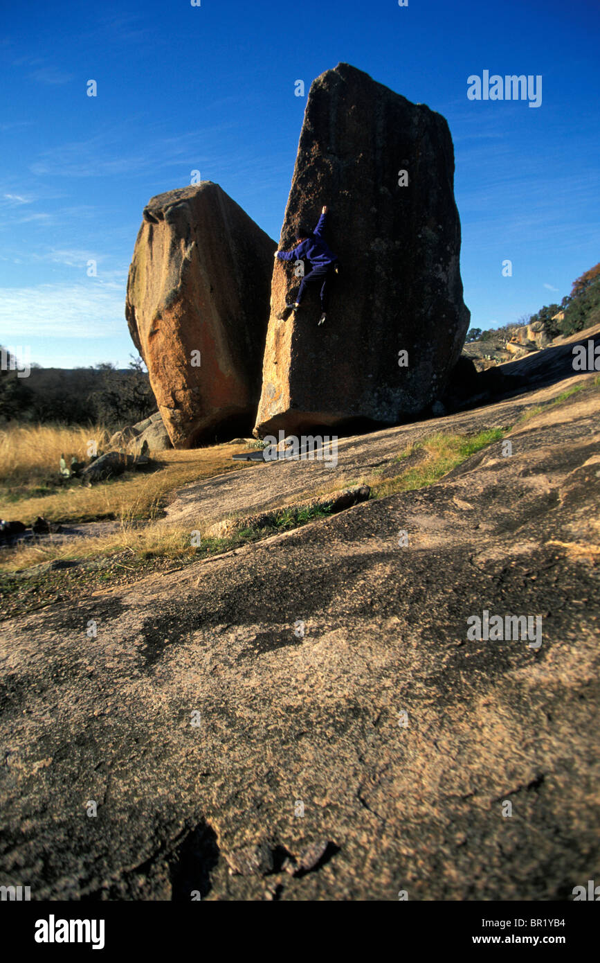 A climber bouldering in a field near Austin, Texas Stock Photo - Alamy