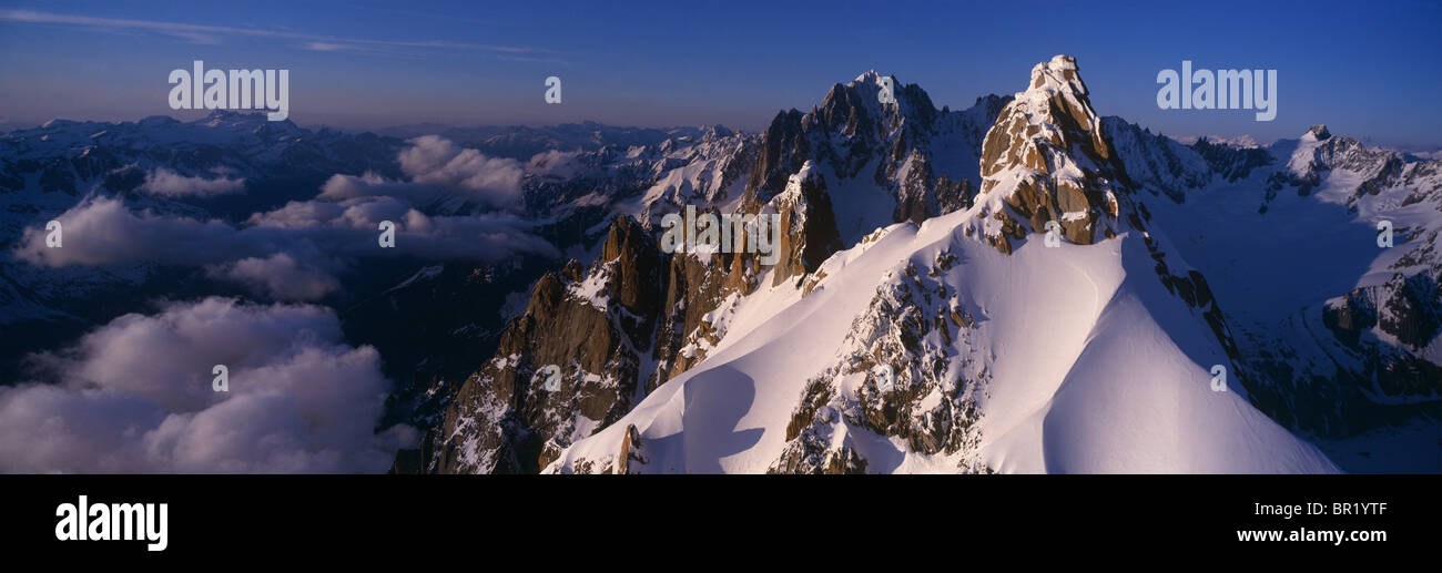 Panoramic of high mountain peaks in the Alps Stock Photo - Alamy