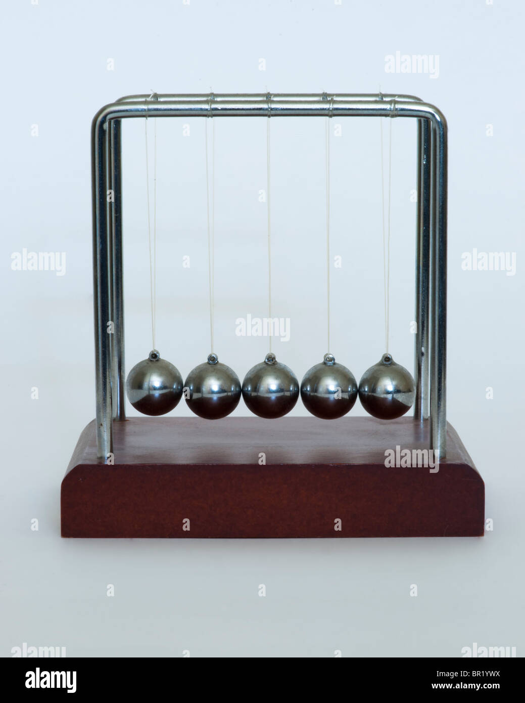 Newton's cradle momentum hi-res stock photography and images - Alamy