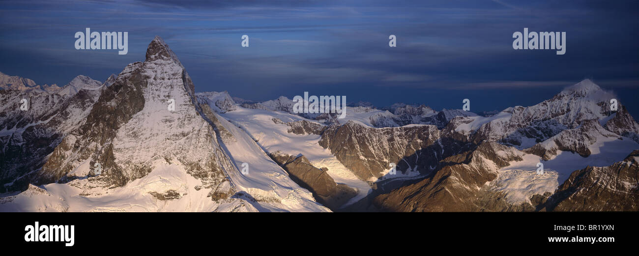 Panoramic of high mountain peaks in the Alps Stock Photo - Alamy