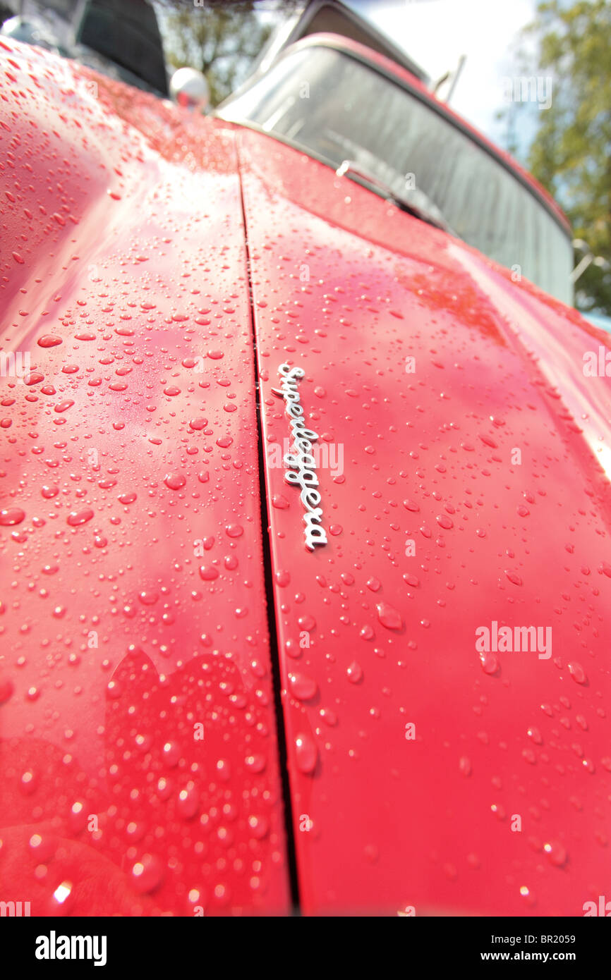 Long red bonnet or hood of a classic red car Stock Photo - Alamy