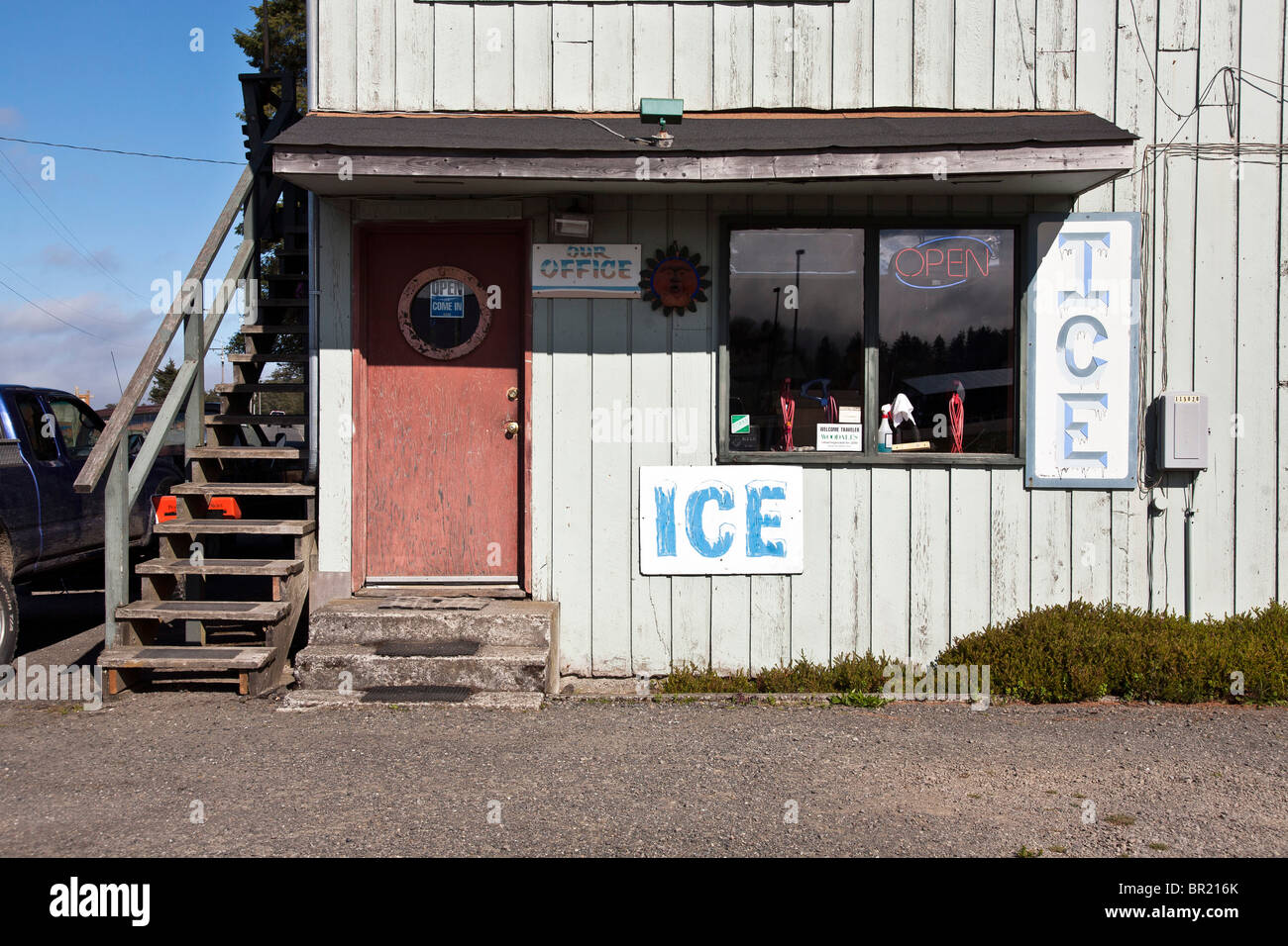 office entrance to charming dilapidated motel with hand lettered signs ...
