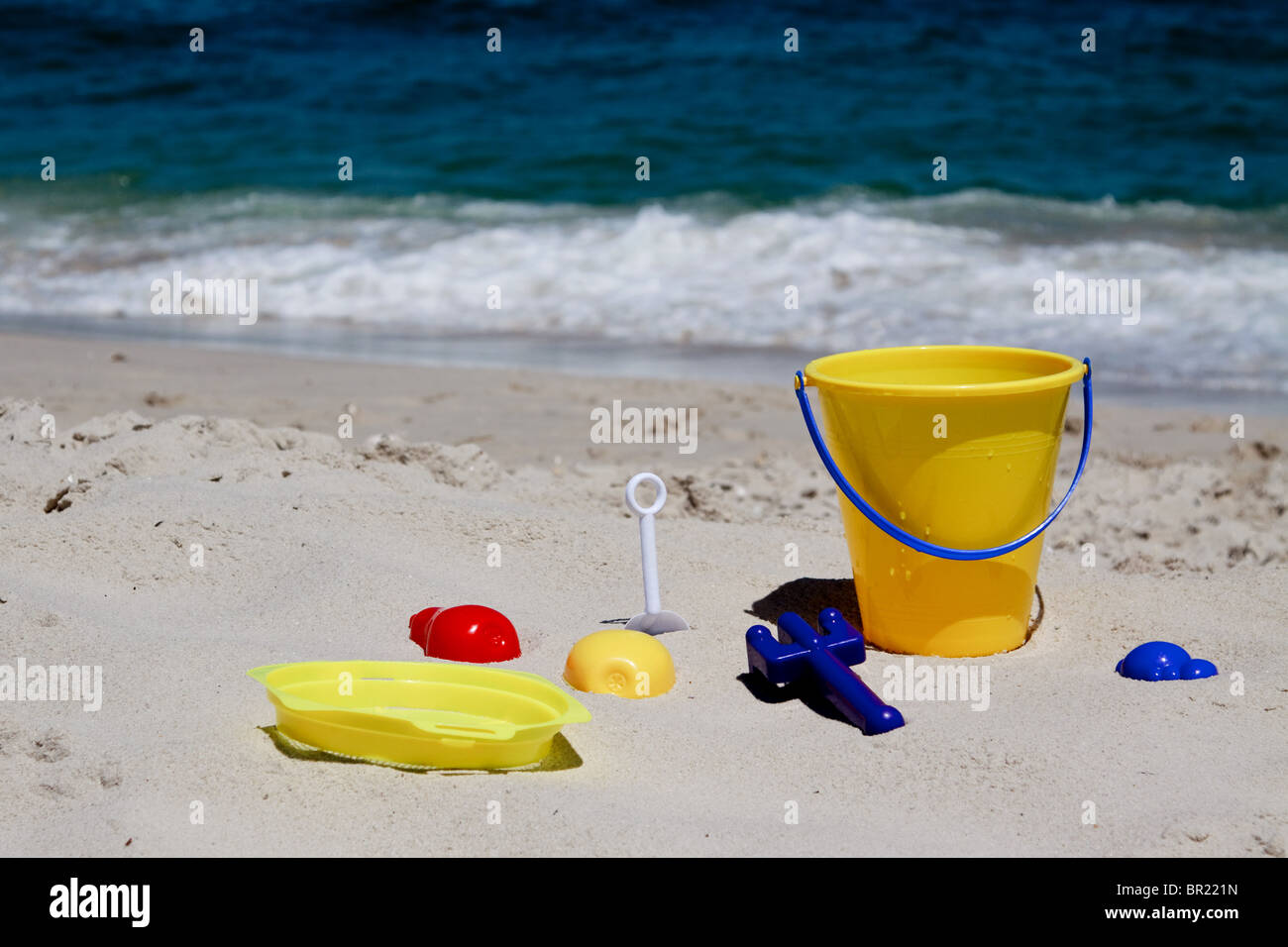 Toys on a beach Stock Photo - Alamy