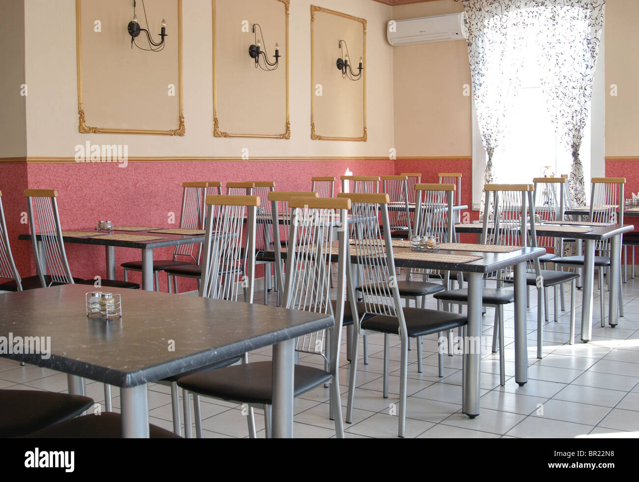 cafe inside - metal tables and chairs Stock Photo - Alamy