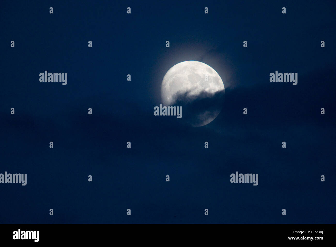 Moon behind clouds hi-res stock photography and images - Alamy
